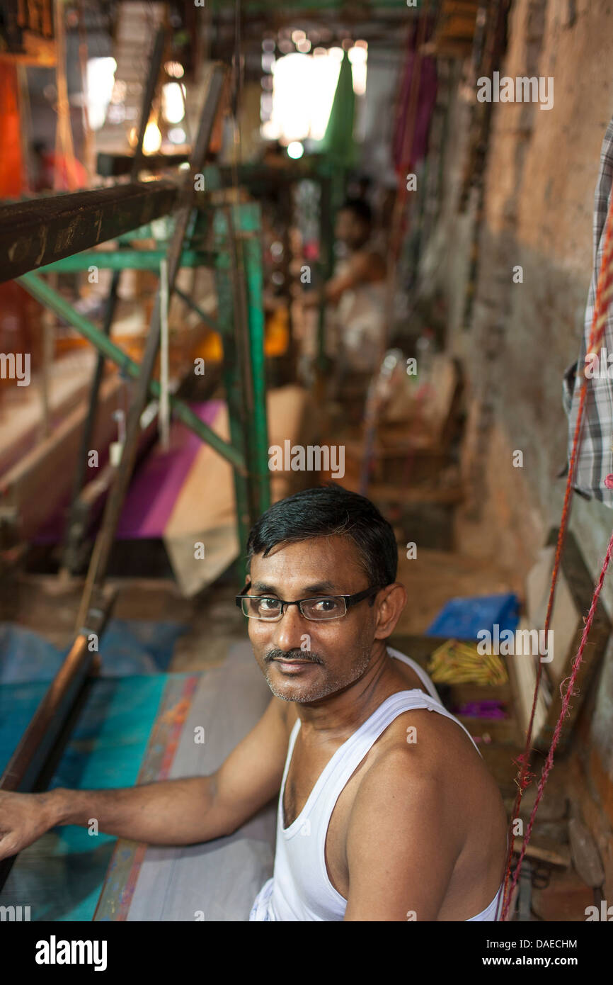 A man operates the loom making Jamdani sari in Mirpur Benarashi Palli ...