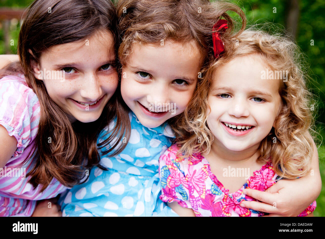 Three Smiling Sisters, Portrait Stock Photo - Alamy