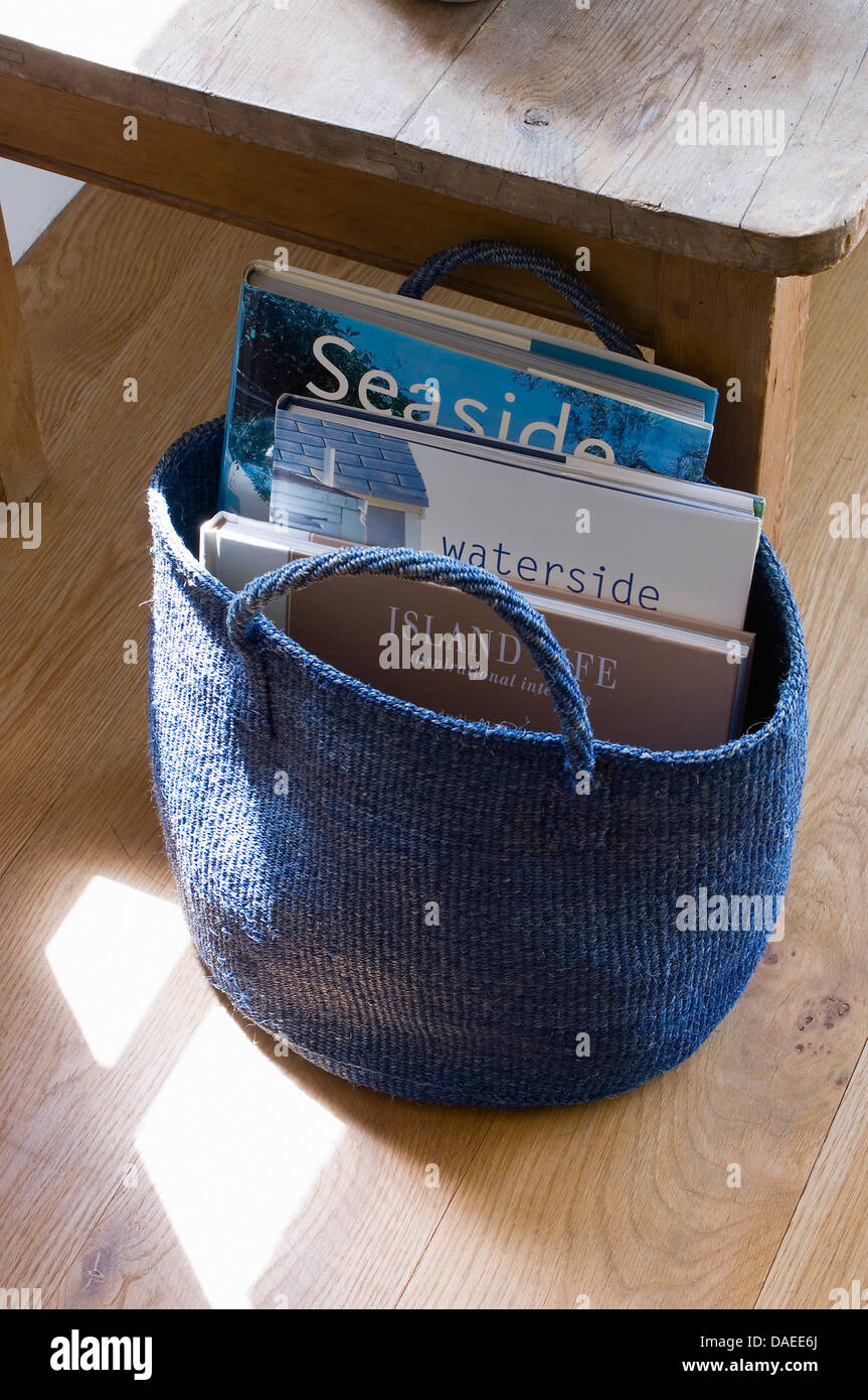 Books stored in bright blue sisal bag Stock Photo - Alamy