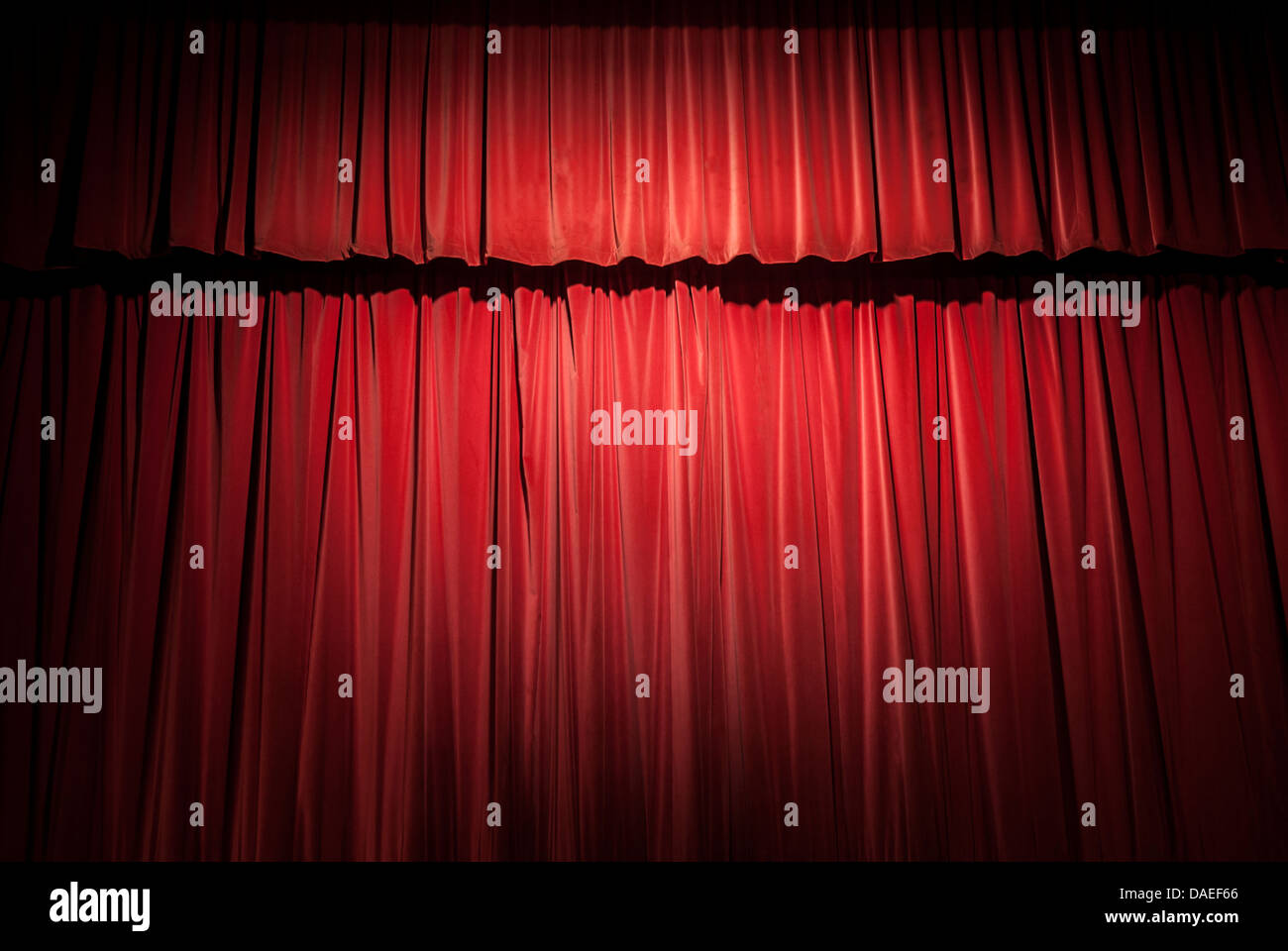 Red velvet stage curtain background Stock Photo - Alamy