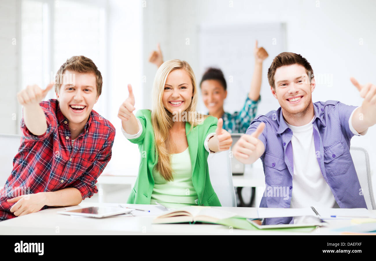 students showing thumbs up at school Stock Photo - Alamy