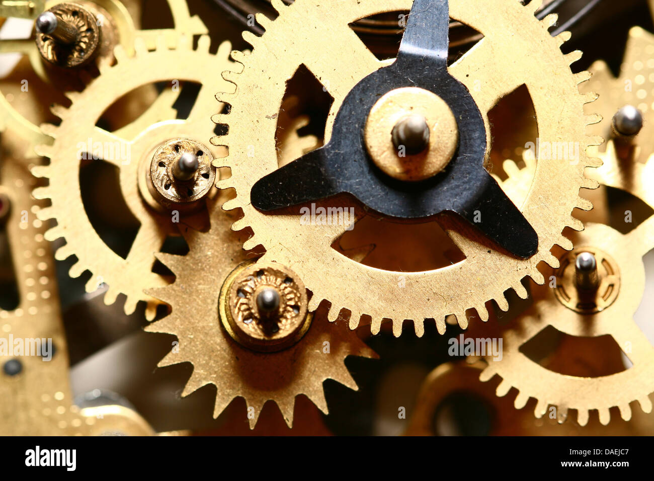 time gear inside my rare clock Stock Photo - Alamy