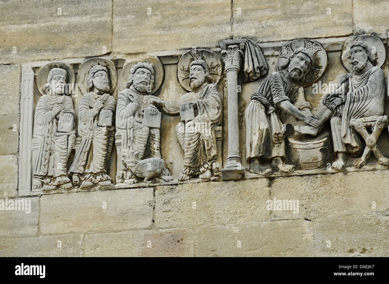 The romanesque frieze at the side wall of Notre Dame des Pommiers ...