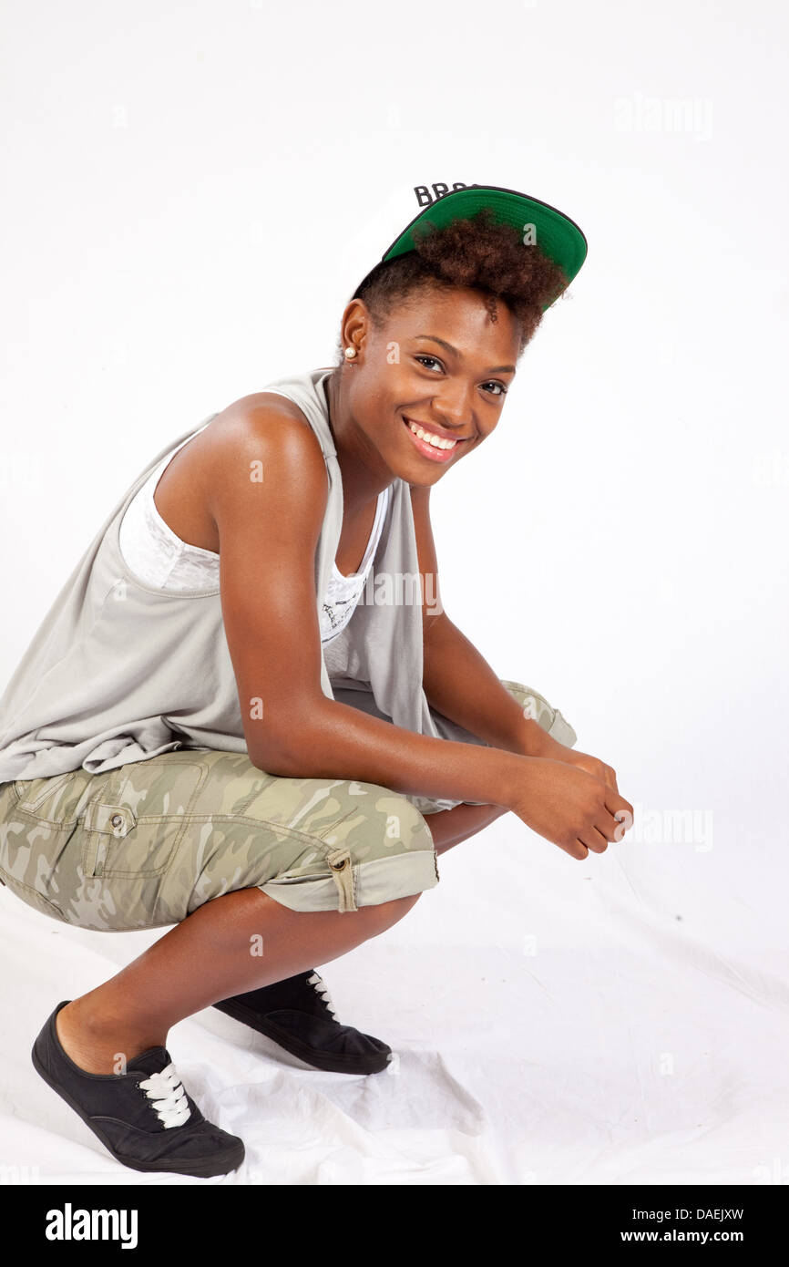 Cute black woman squatting on hi-res stock photography and images - Alamy