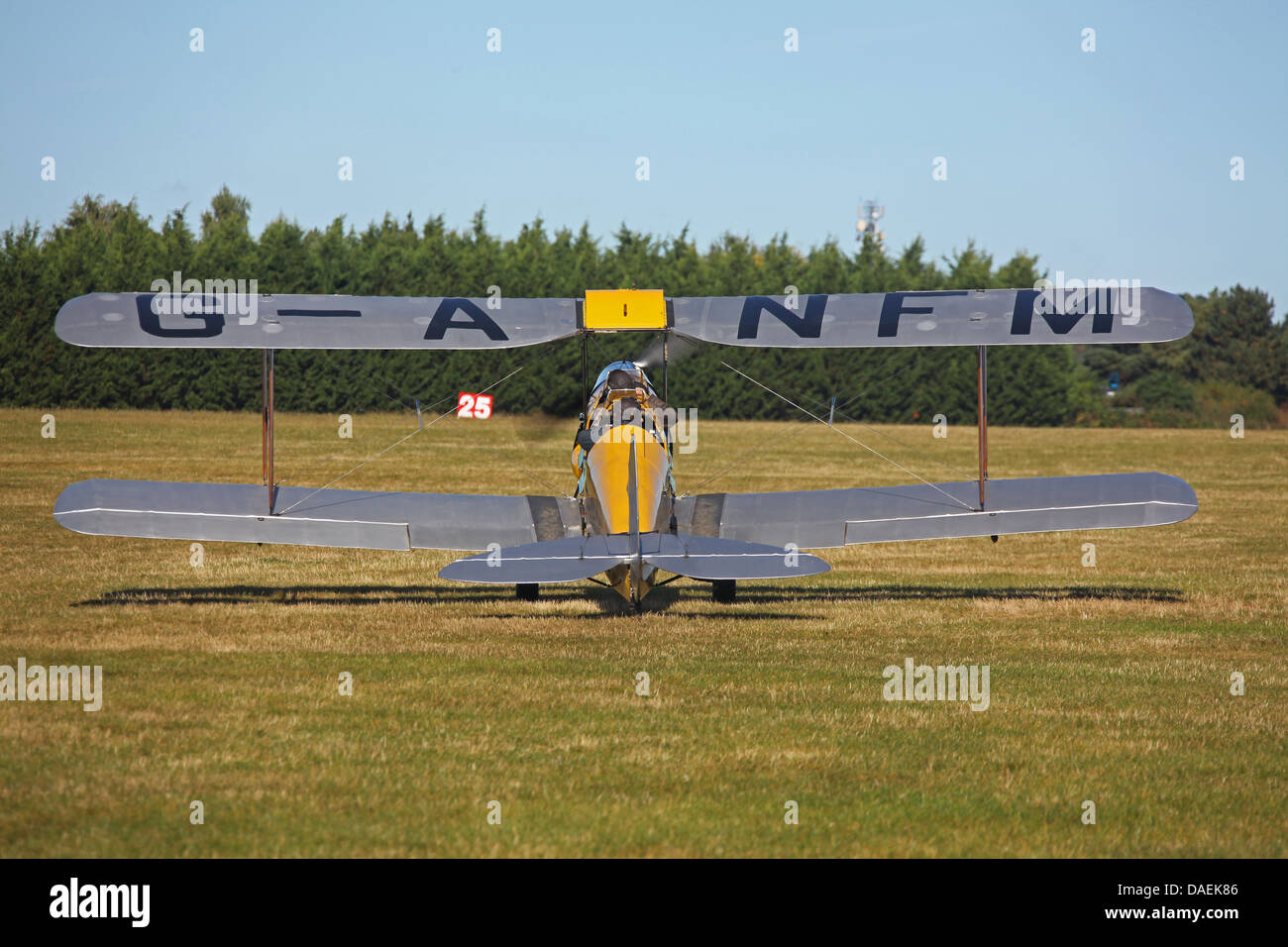 A biplane readying for taxiing to the runway on a fine day Stock Photo ...