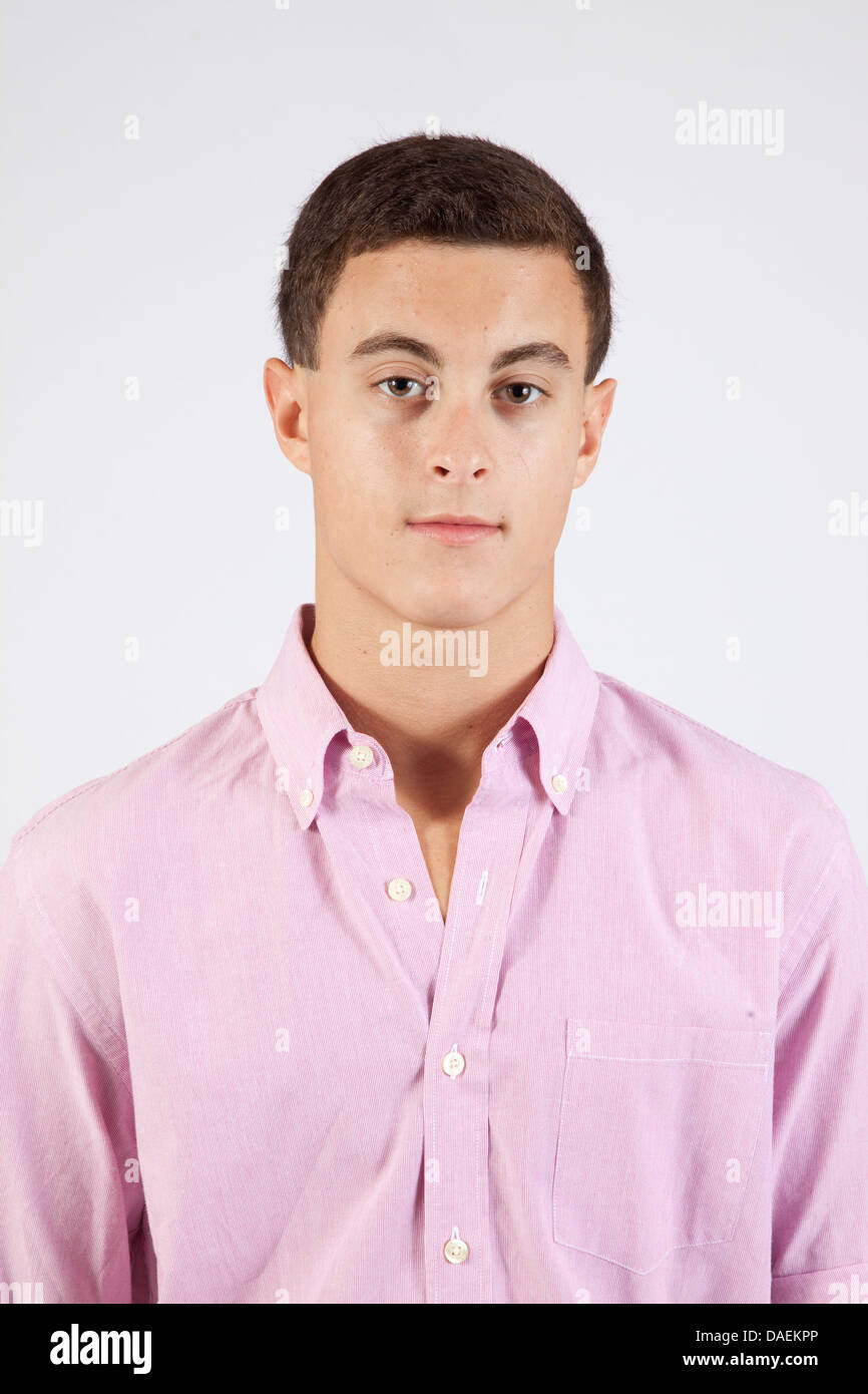 Handsome man standing looking thoughtfully at the camera Stock Photo ...