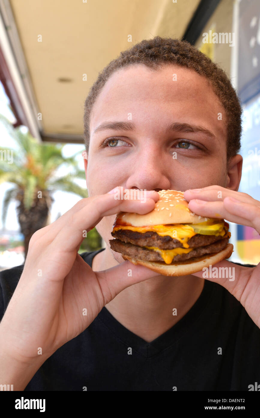 An 18-year-old male eats fast food Stock Photo - Alamy