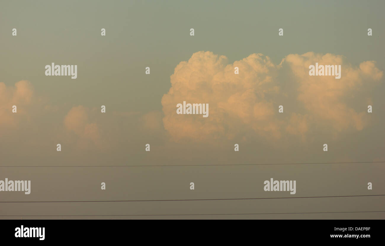 Clouds sunset in the horizon above wires, Stratocumulus stratiformis ...