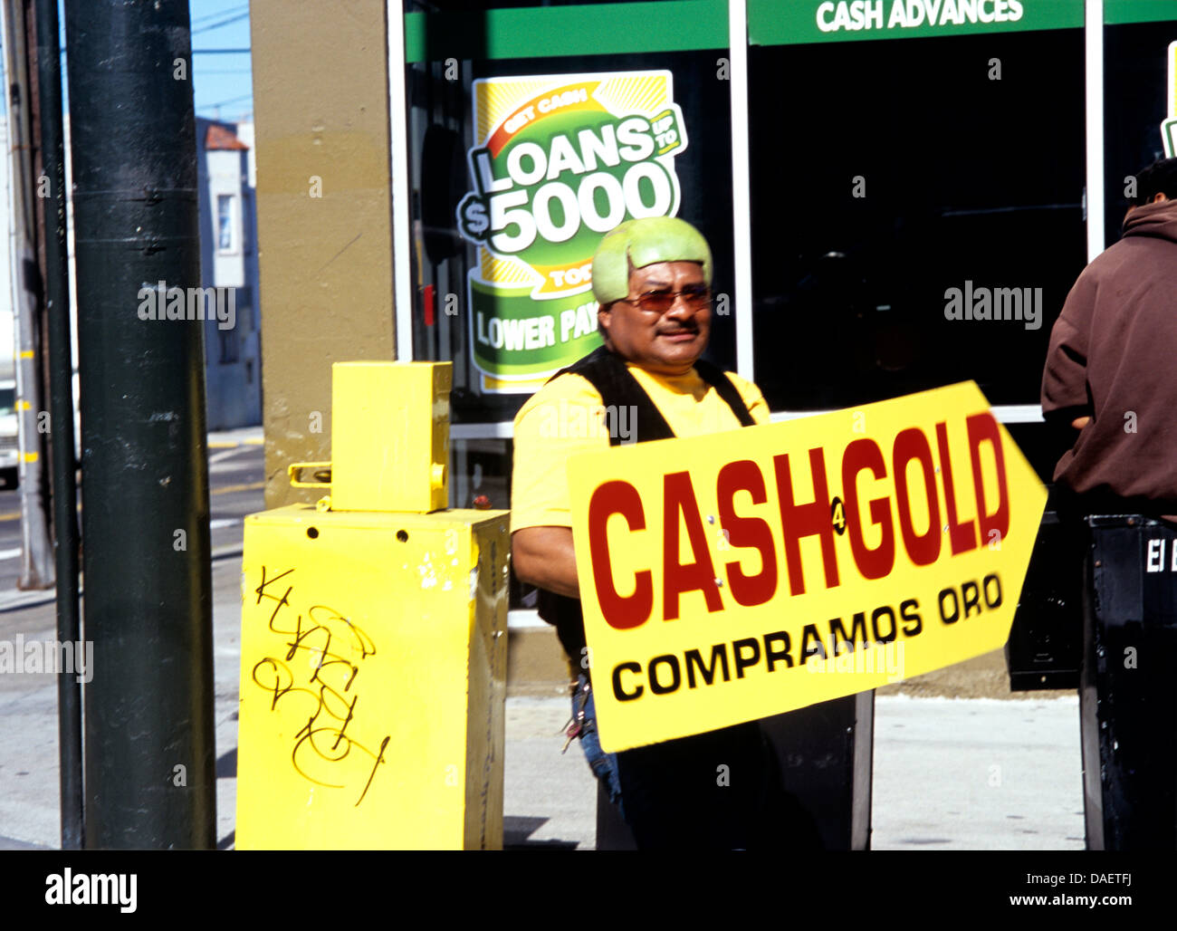 man in mission district holds sign cash for gold Stock Photo - Alamy