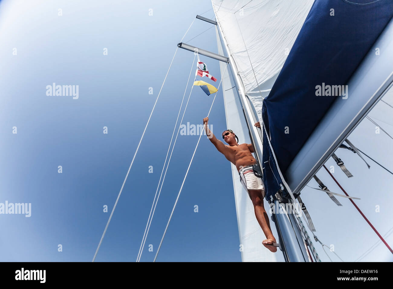 Handsome man working on sailing ship, cute sailor fixed sail, young ...