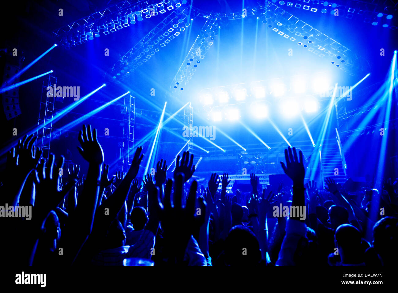 Rock concert, crowd of young people enjoying night performance, raised ...