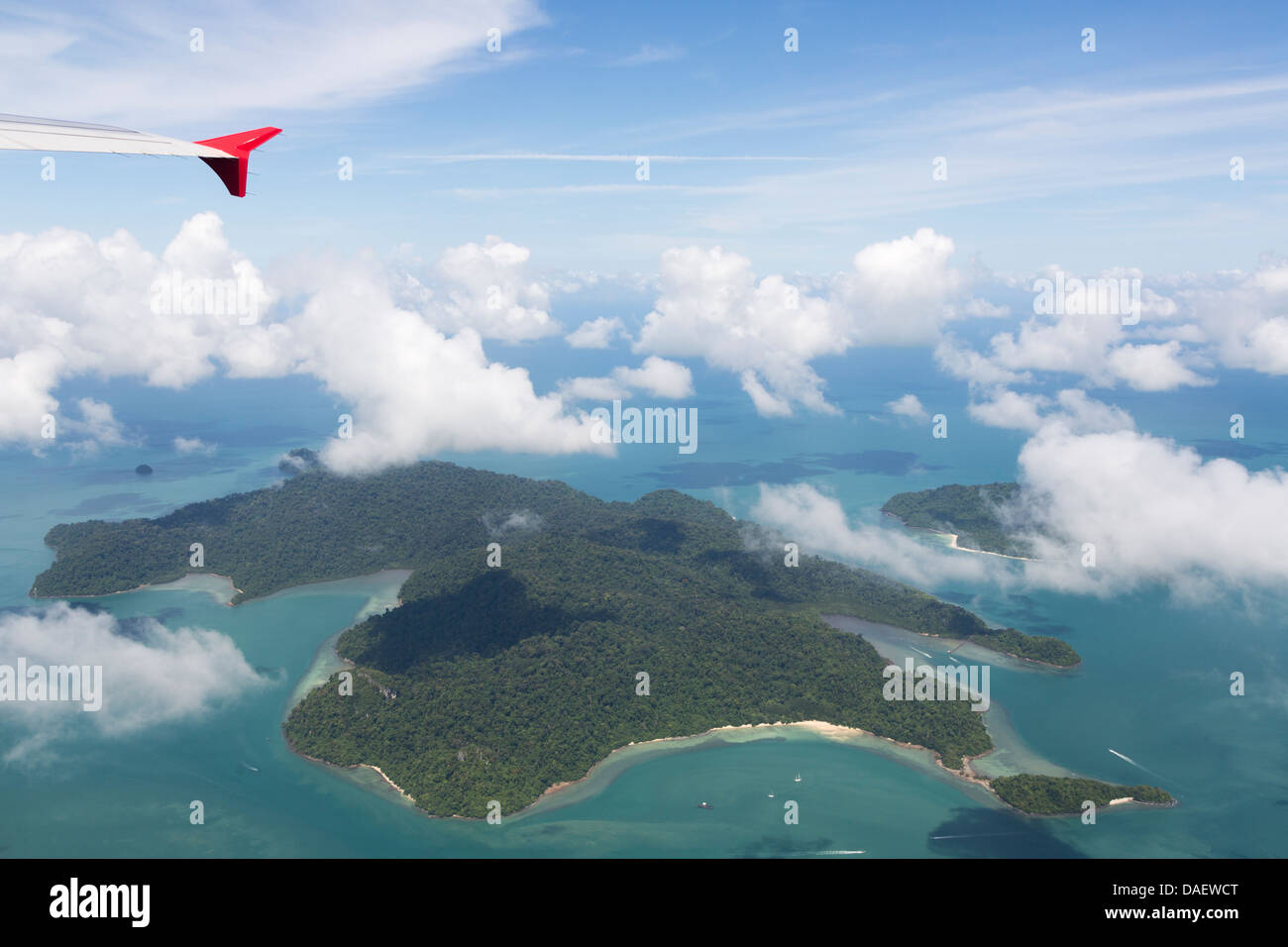 Flying over an island of the Langkawi archipelago in the Andaman sea ...