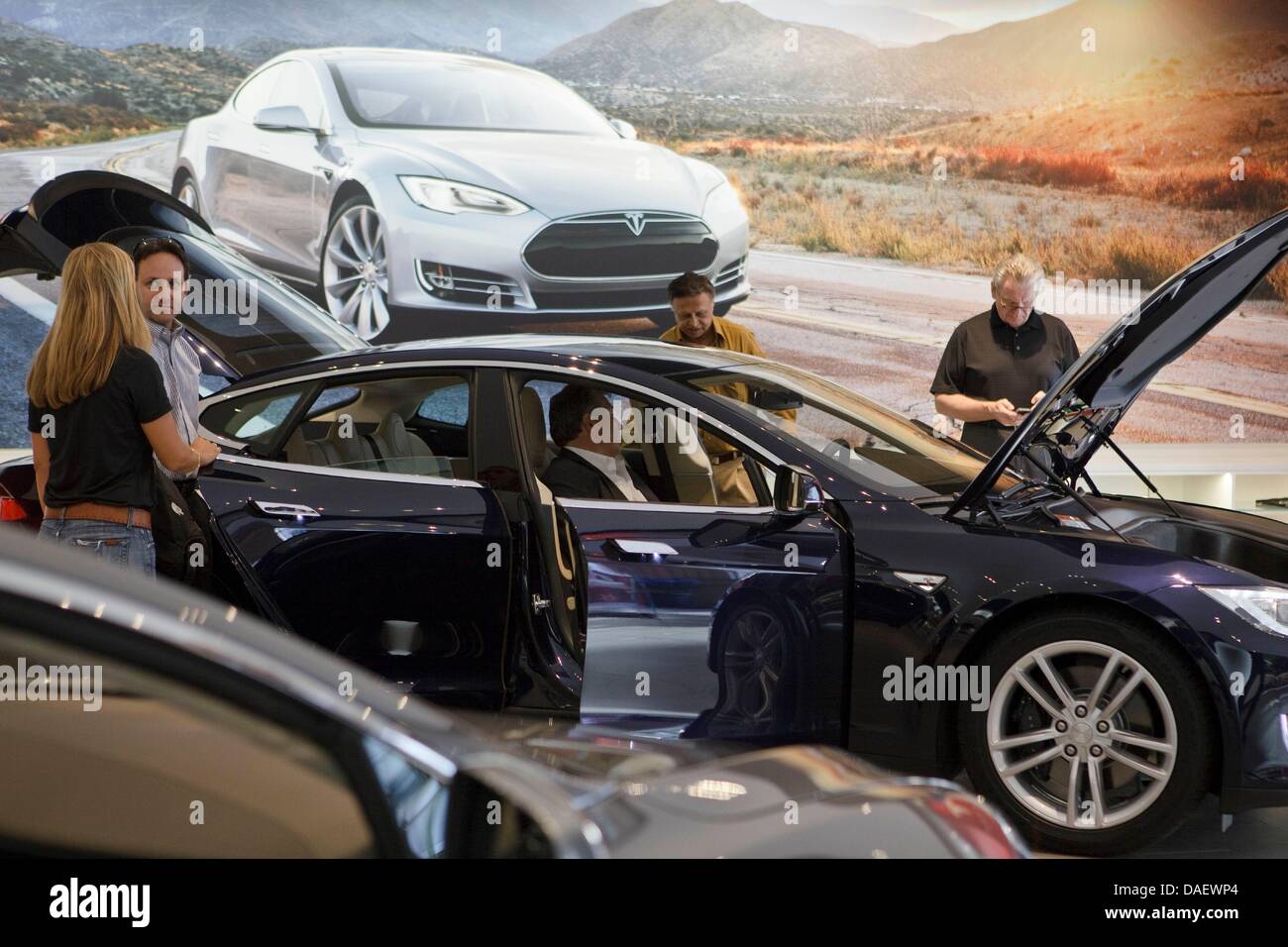 July 11, 2013 - San Jose, California, U.S. - Customers look at a Tesla ...