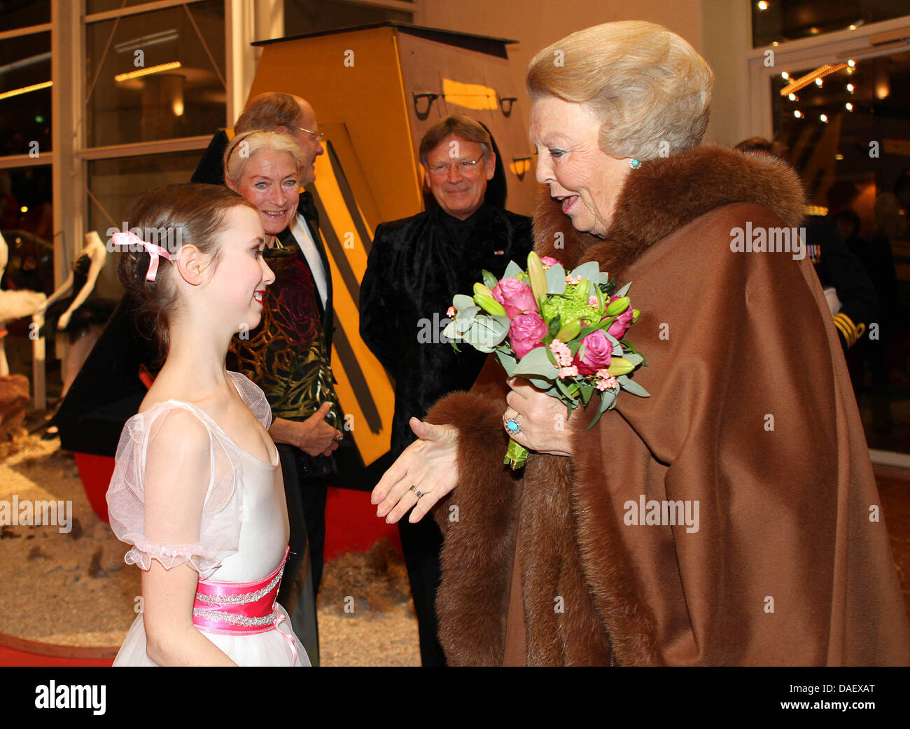 Dutch Queen Beatrix receives flowers next to Alexandra Radius and Han ...
