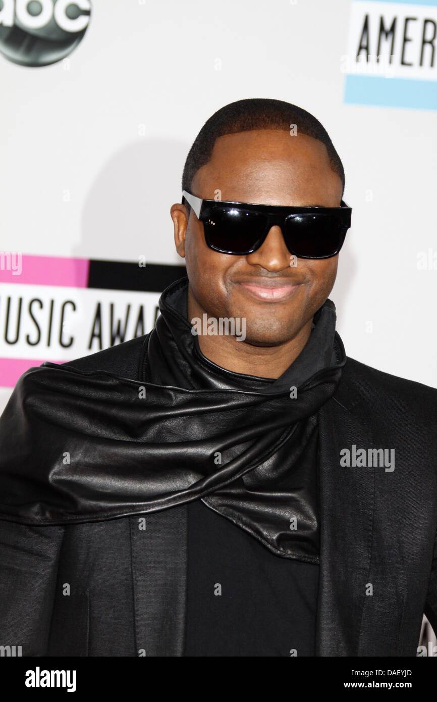 Singer Taio Cruz arrives at the 2011 American Music Awards at Nokia ...