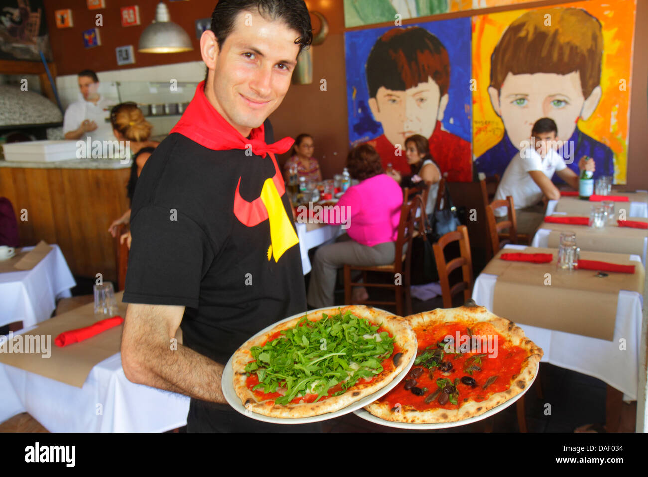 Pizzas waiter hi-res stock photography and images - Alamy