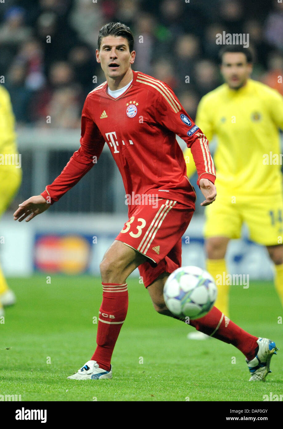Munich's Mario Gomez eyes the ball during the Champions League group A ...