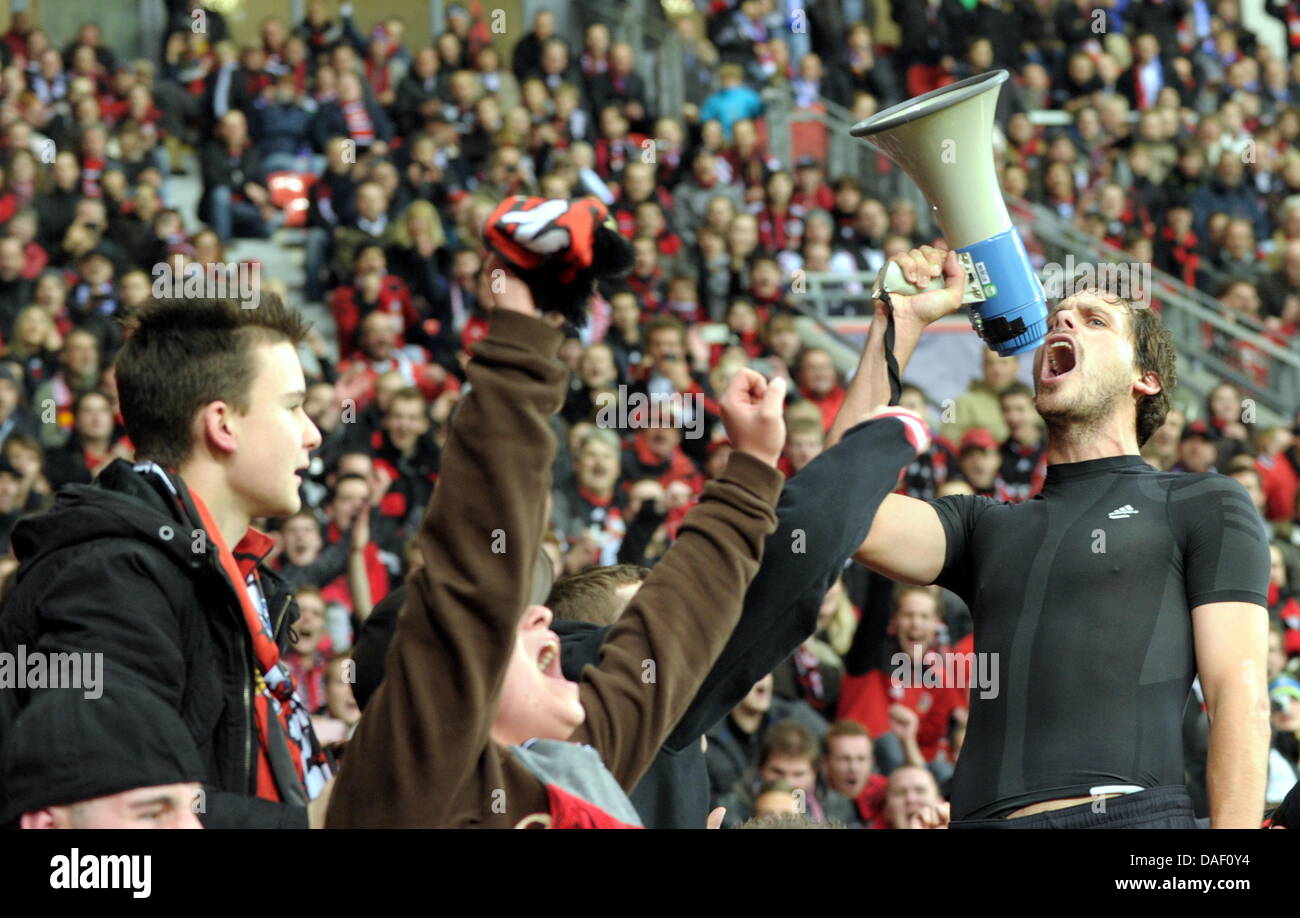 Manuel Friedrich of Leverkusen celebrate with the supporters after ...