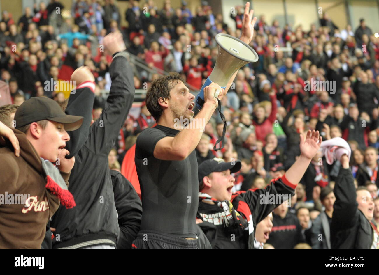 Manuel Friedrich of Leverkusen celebrate with the supporters after ...