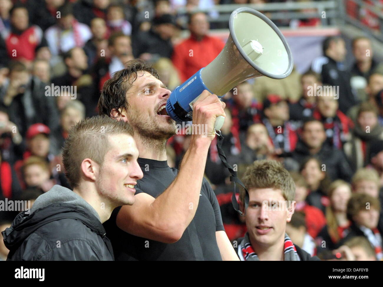 Manuel Friedrich of Leverkusen celebrates with the supporters after ...