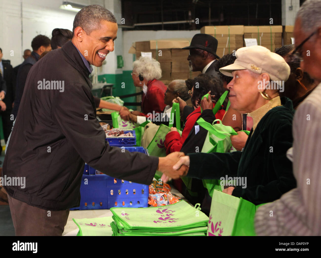 United States President Barack Obama shakes hands with an unidentified ...