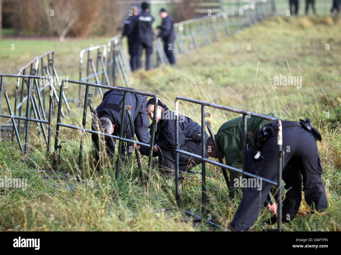 Police erect crowd-control barriers in Dannenberg, Germany, 25 November ...