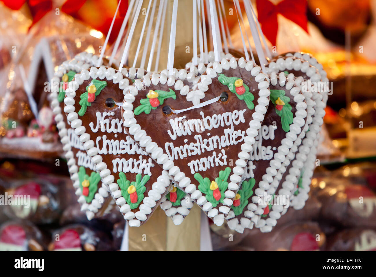 A gingerbread cookie in the shape of a heart and reading ...