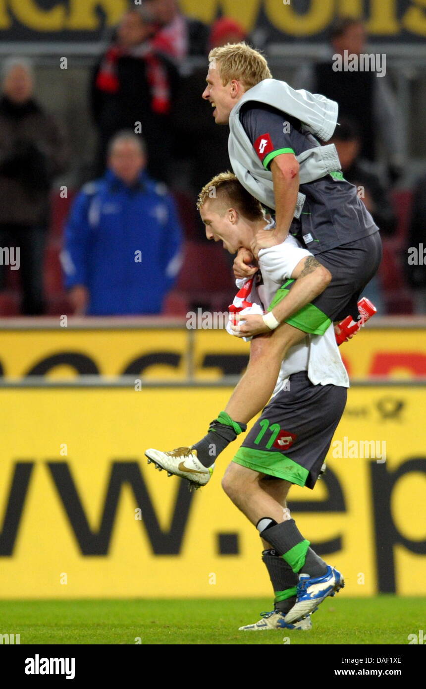 Gladbach's Marco Reus and Mike Hanke (top) cheer after scoring the ...