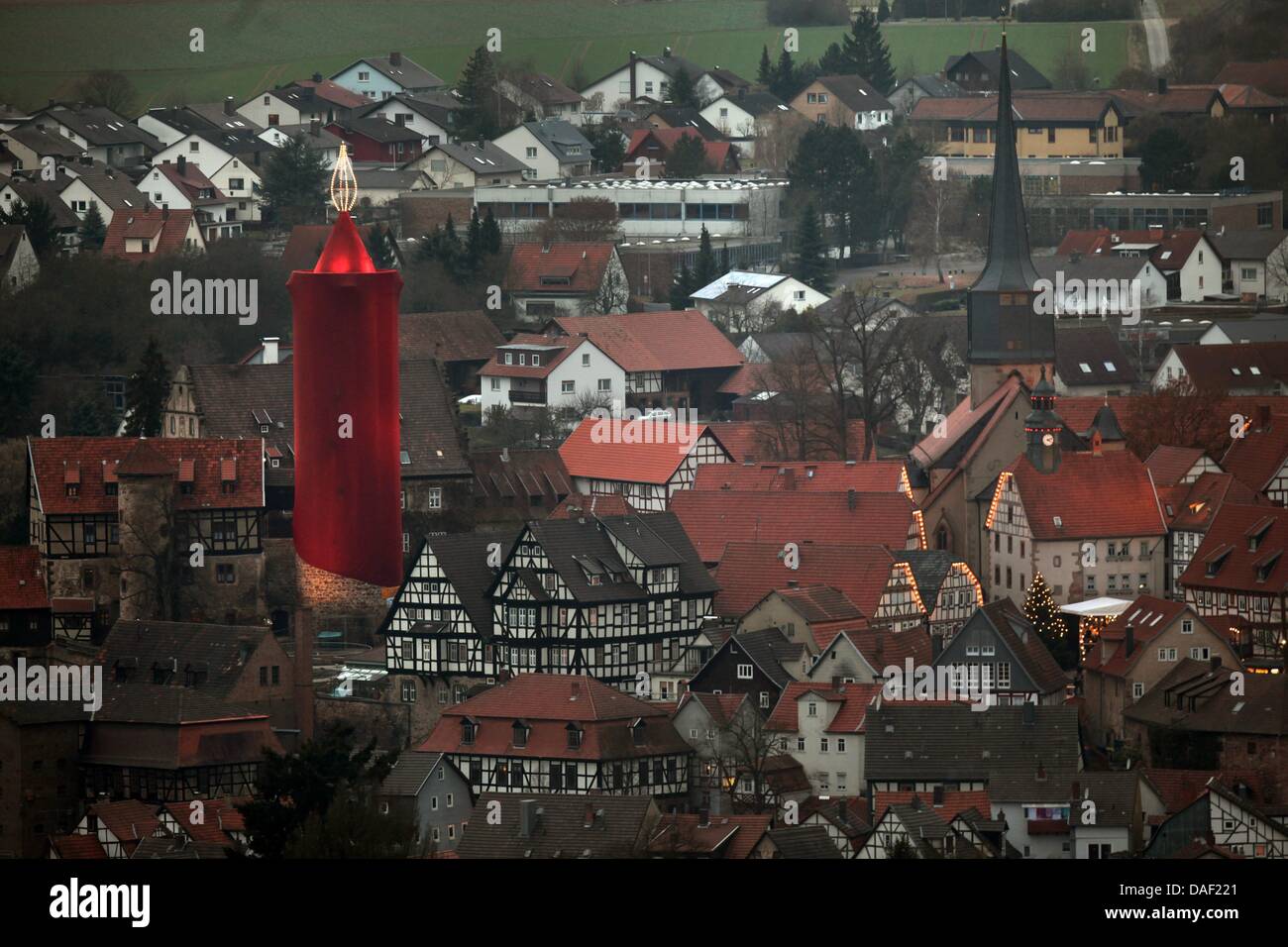 A tower has been veiled in red cloth to symbolize the 'biggest candle ...
