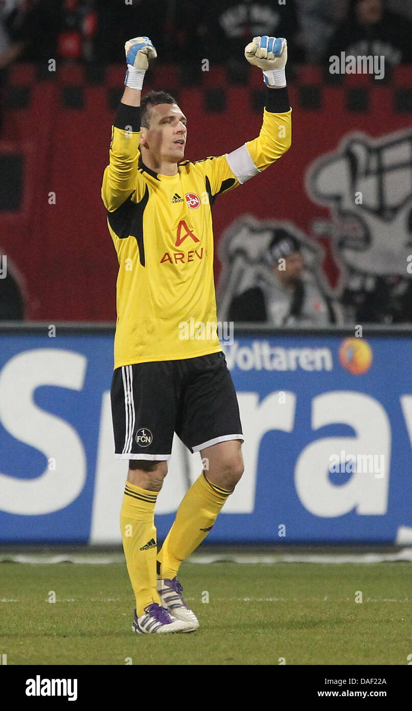 Nuremberg's goalkeeper Raphael Schaefer celebrates the victory of his ...