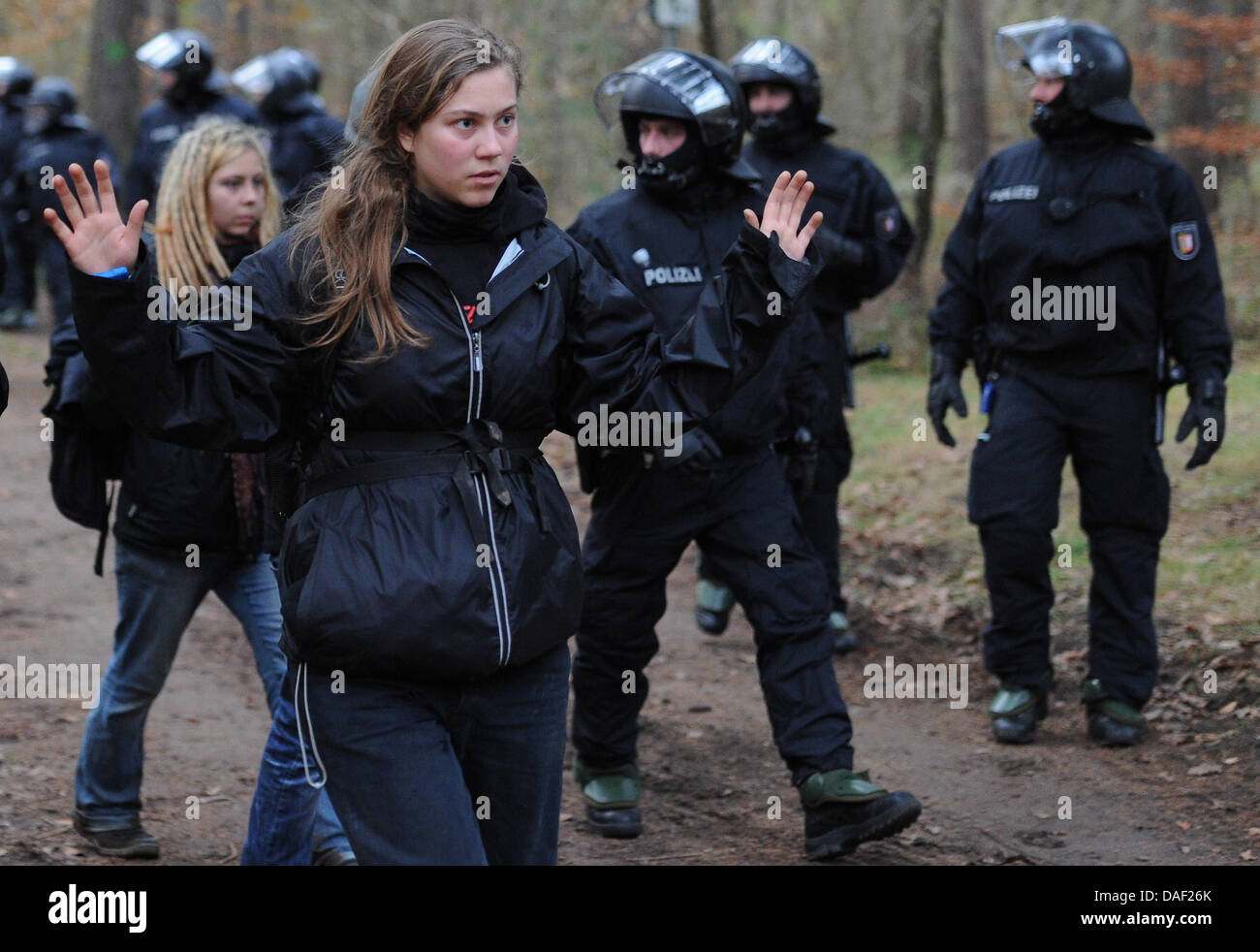 Anti-nuclear activists walk through the forest and are stopped by the ...