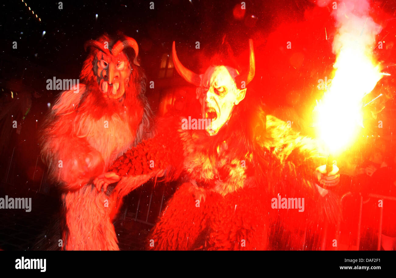 Winter fools, also known as Klausen, march in a procession through the ...