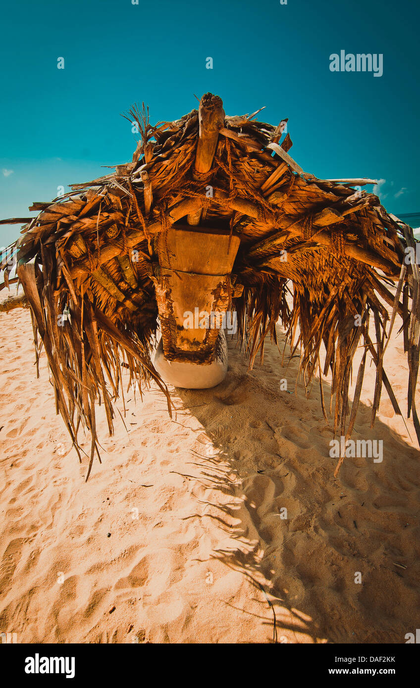 Boat on the beach with coconut cover Stock Photo - Alamy
