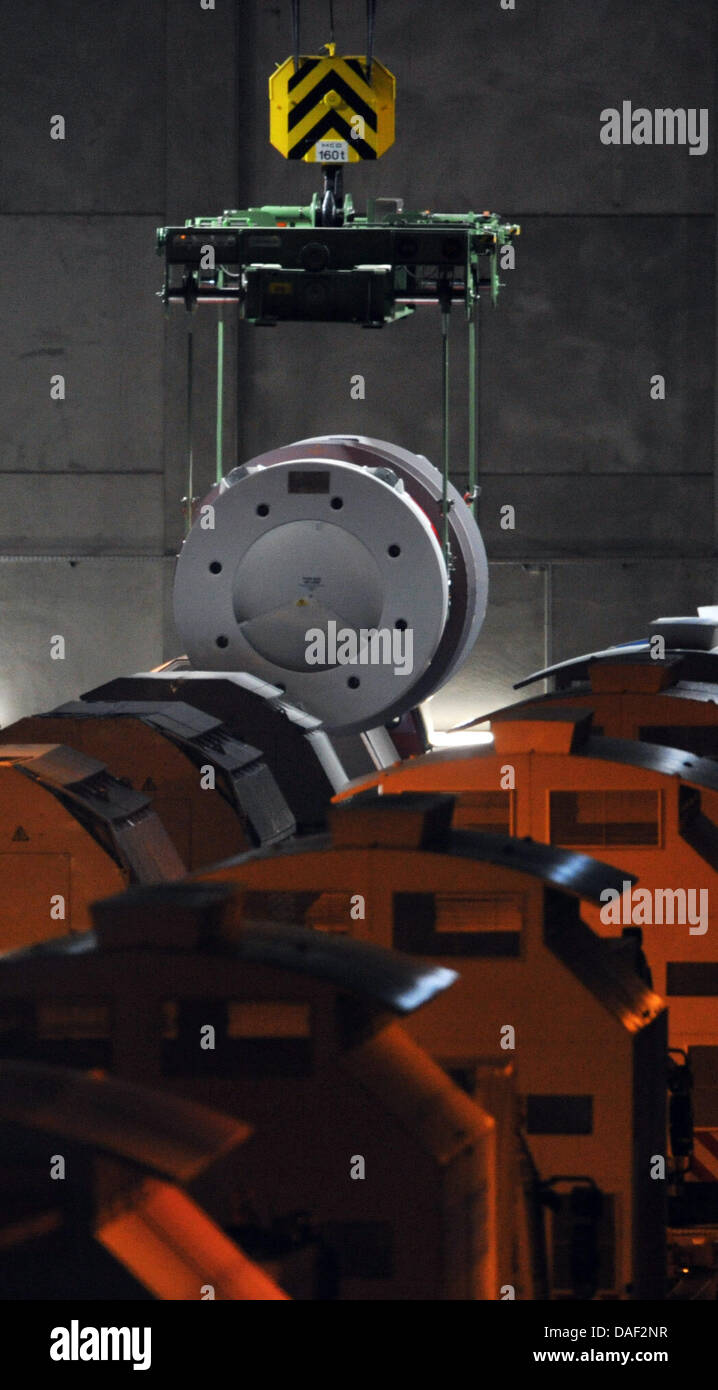 The castor containers with nuclear waste is moved from the train onto ...