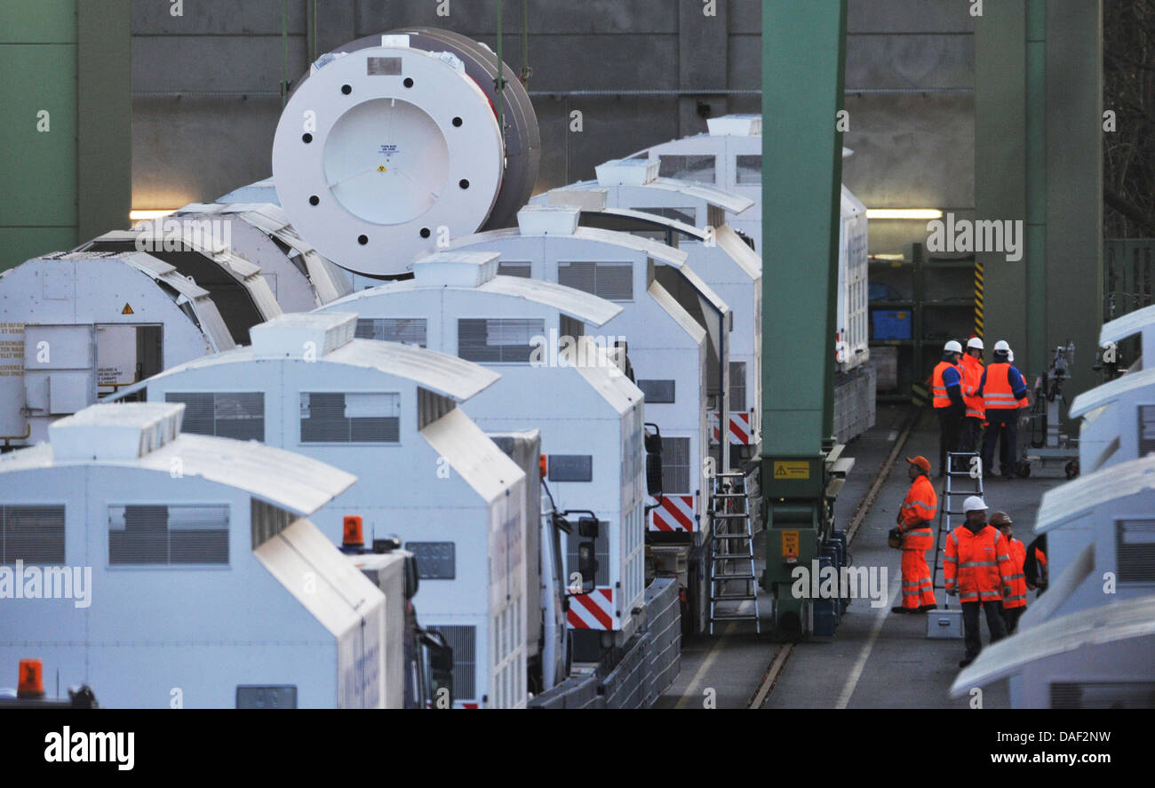 The castor containers with nuclear waste is moved from the train onto ...