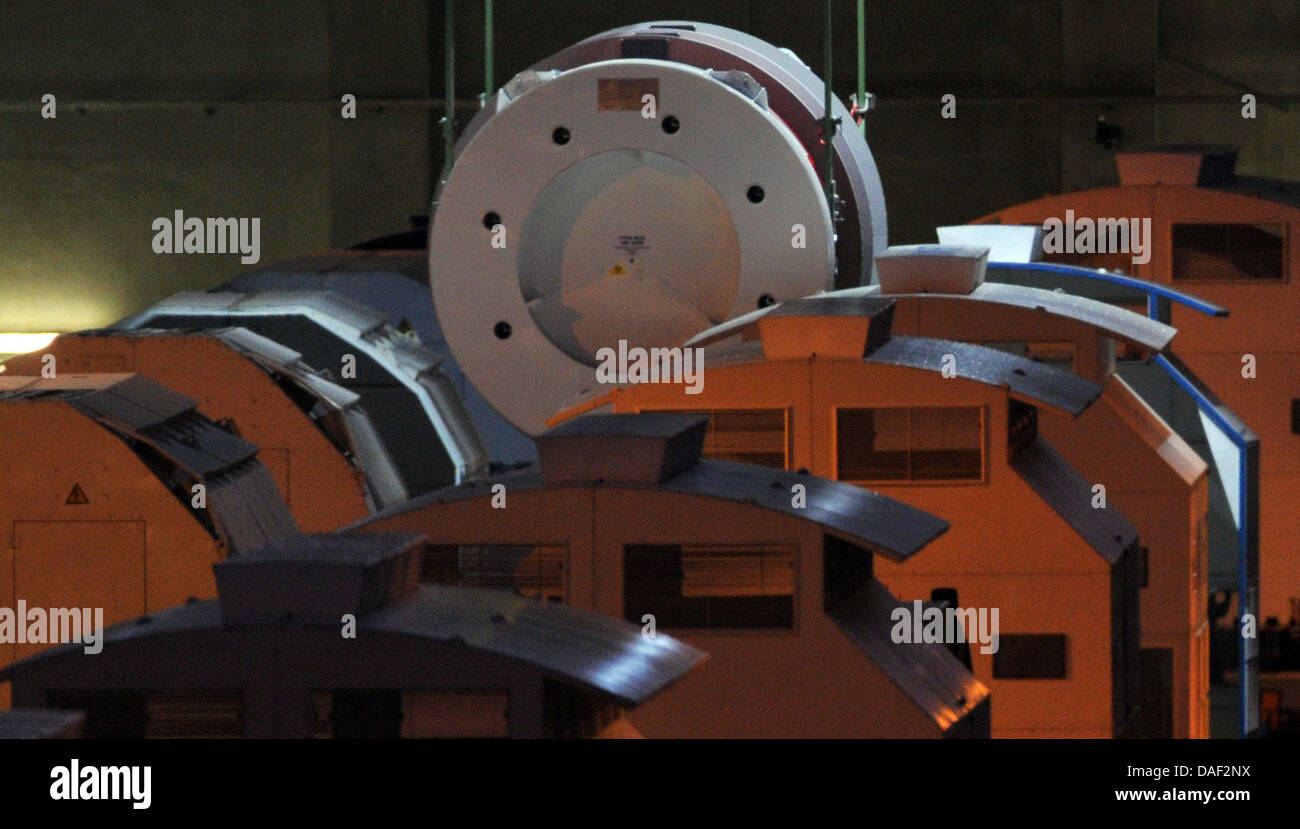 The castor containers with nuclear waste is moved from the train onto ...