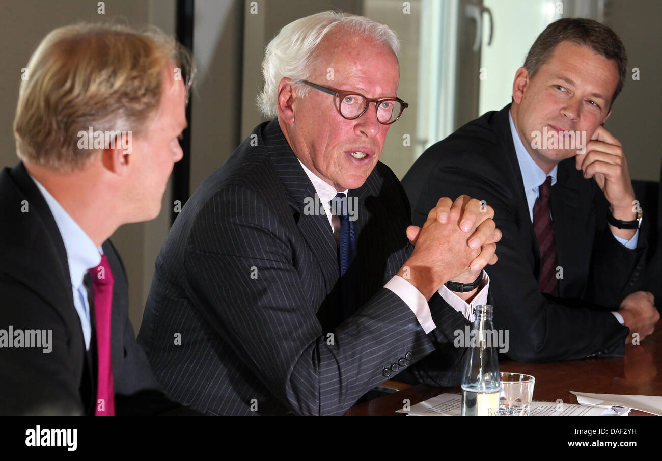 MPC CEO Axel Schroeder (C) and his sons John Benjamin Schroeder (L) and ...