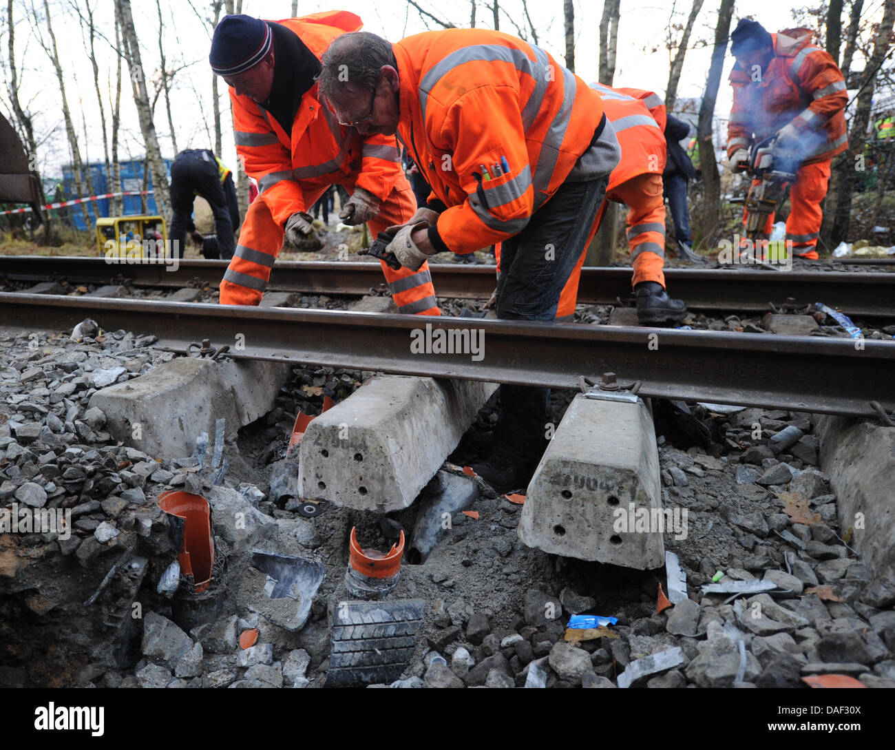 Deutsche Bahn workers repair tracks that had been damaged by ...