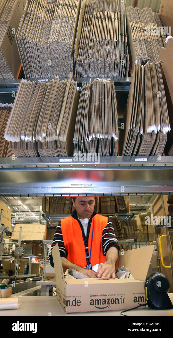 An Amazon employee works inside the online seller's new logistics ...