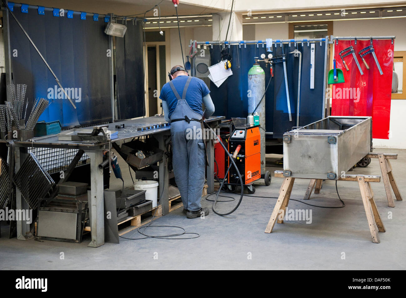 An inmate is working in the metalworking shop at Waldeck prison in ...