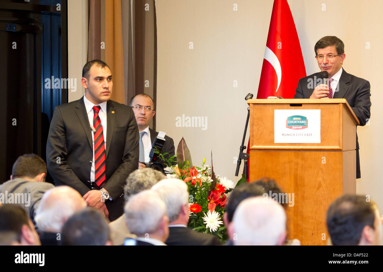 Foreign Minister of Turkey Ahmet Davutoglu talks to members of the ...