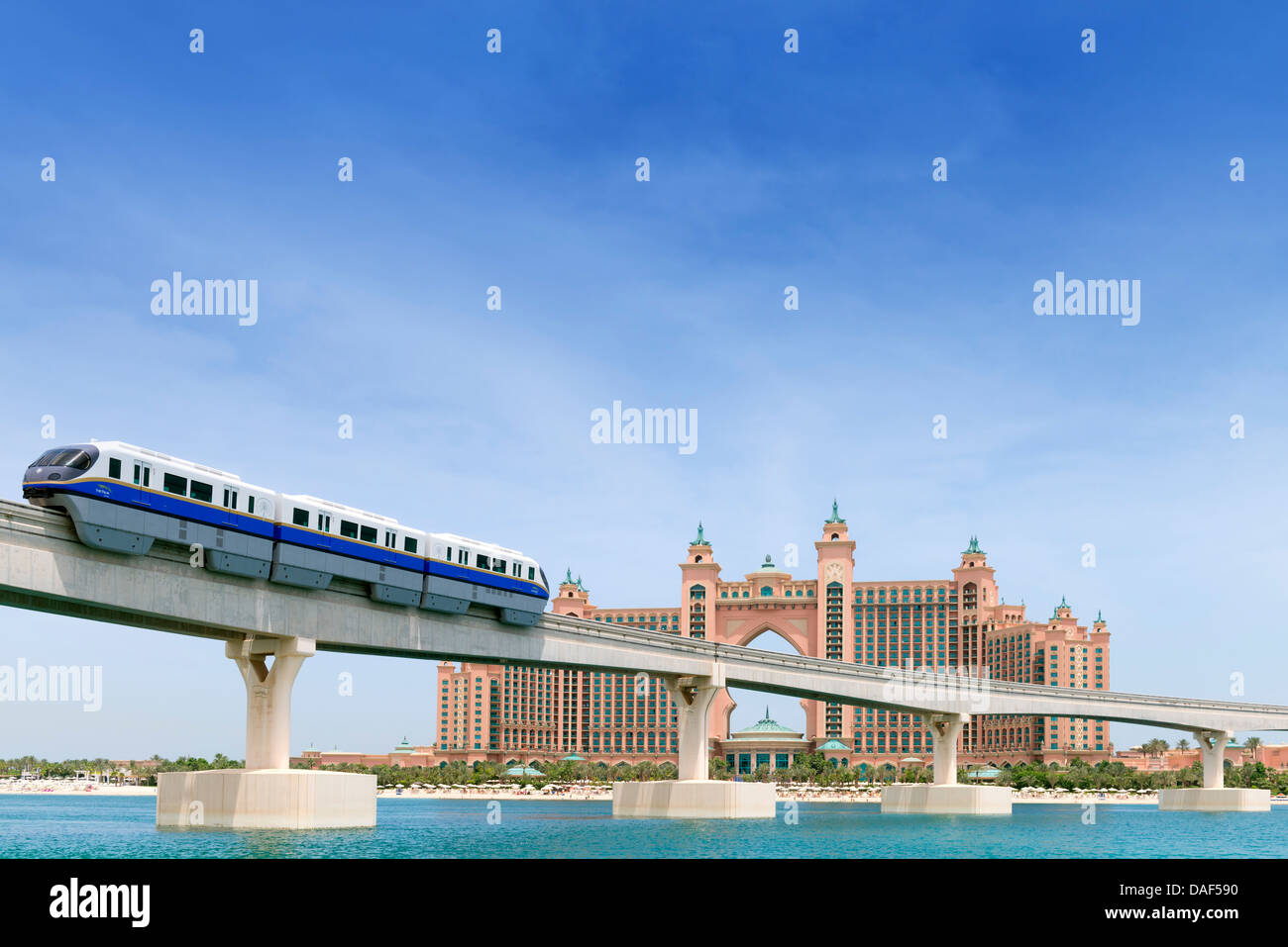 Monorail train approaching The Palm Atlantis luxury hotel on artificial ...