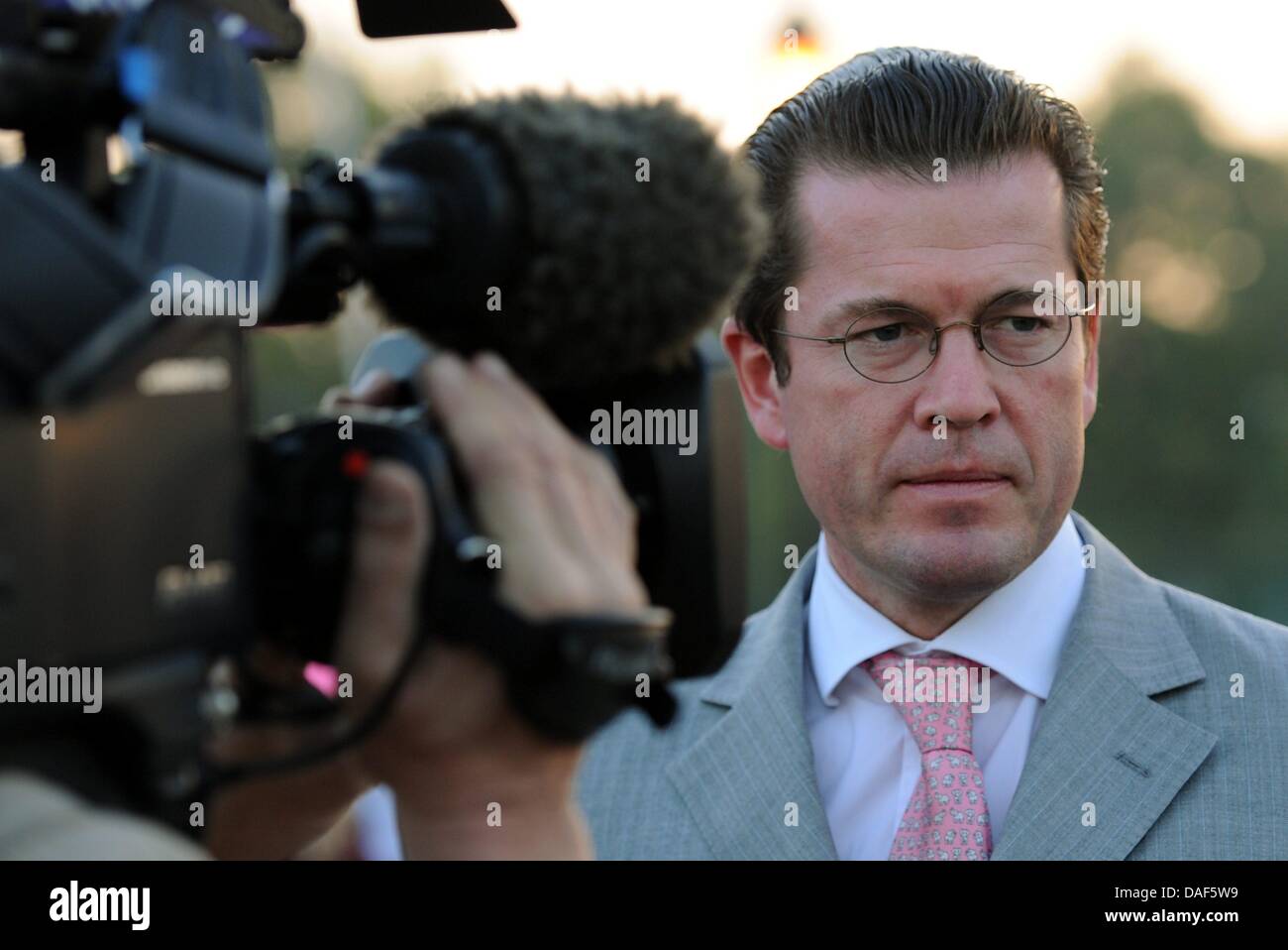 German Minister of Defence Karl-Theodor zu Guttenberg stands in front ...