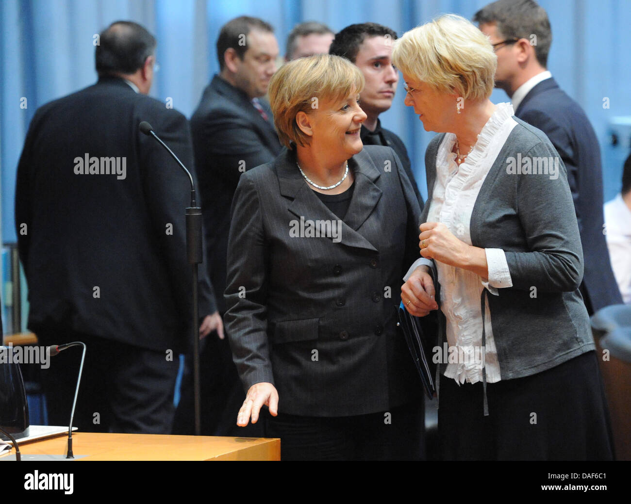 German Chancellor Angela Merkel (L) arrives with enquiry board ...