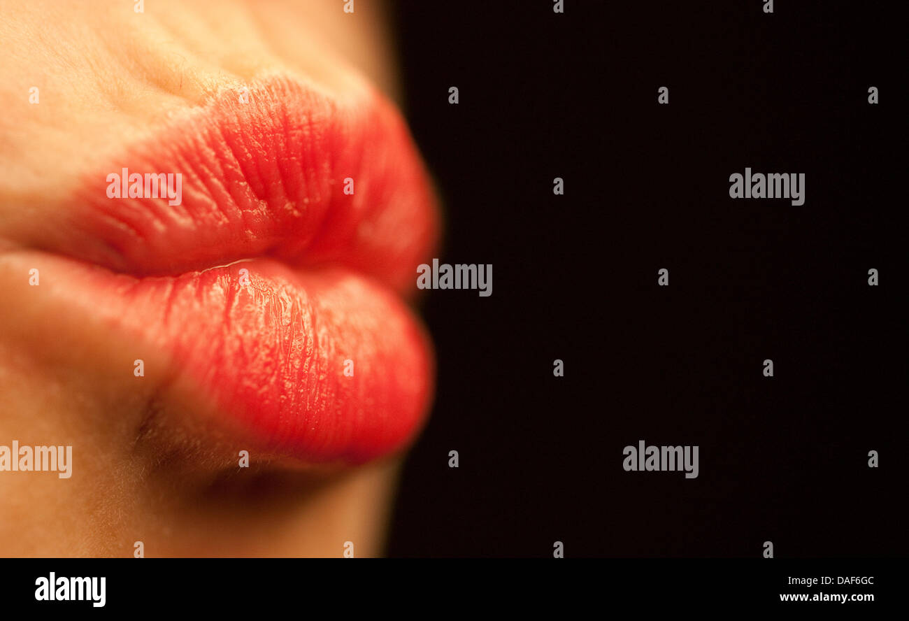 A woman makes puckered lips in Cologne, Germany, 10 February 2011 ...