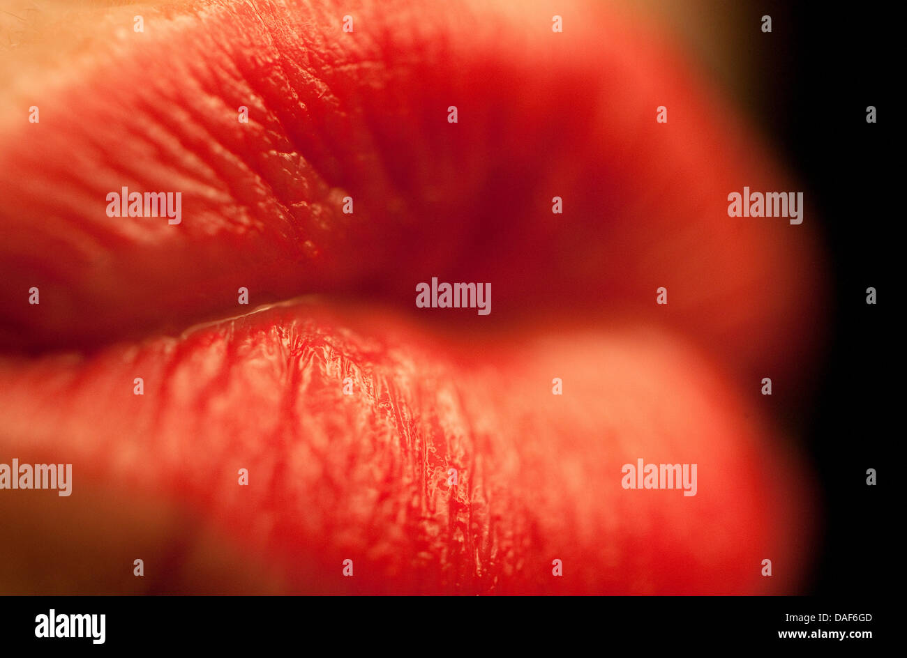 A woman makes puckered lips in Cologne, Germany, 10 February 2011 ...