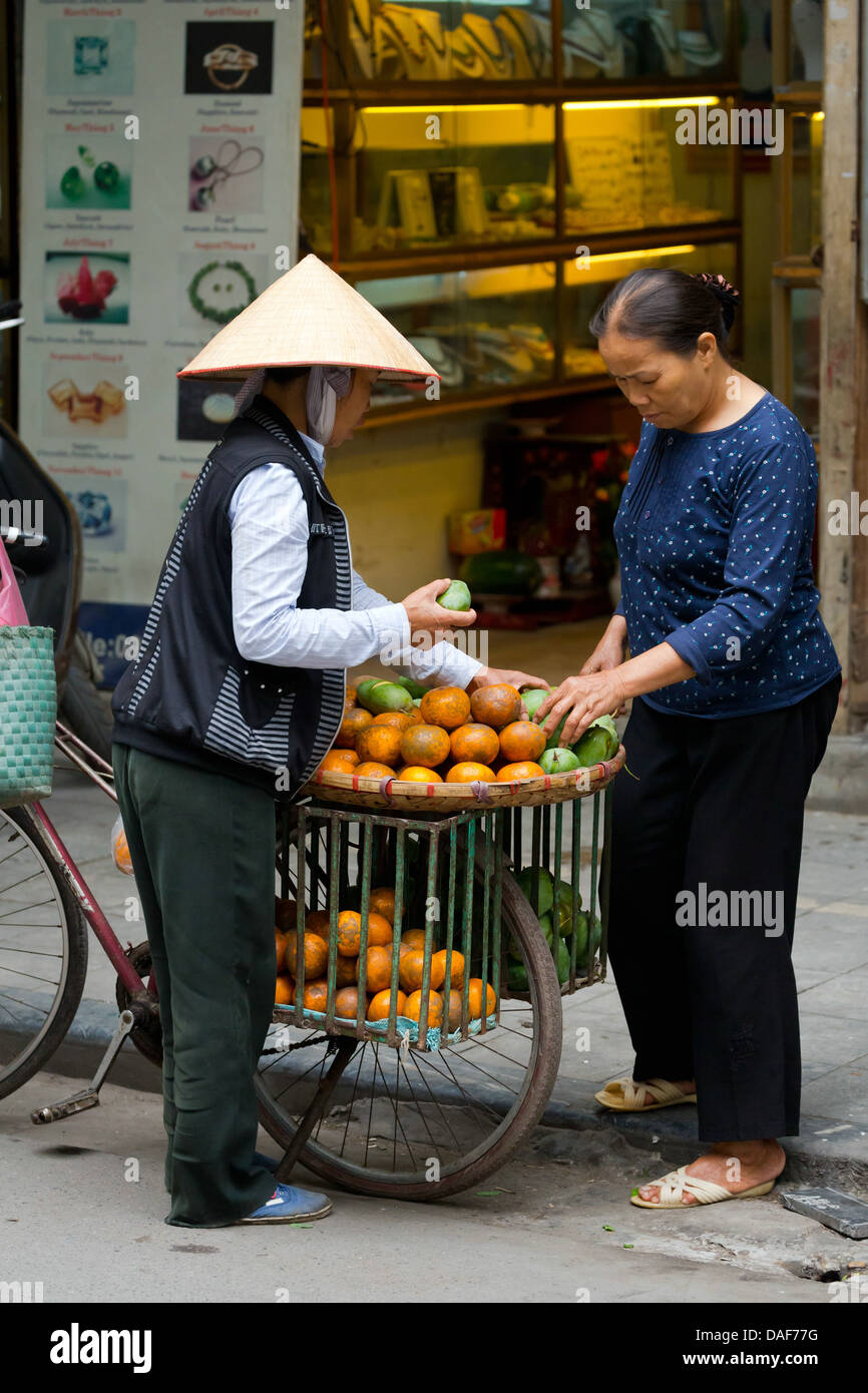 Typical Street Seller in Hanoi, Vietnam Stock Photo - Alamy