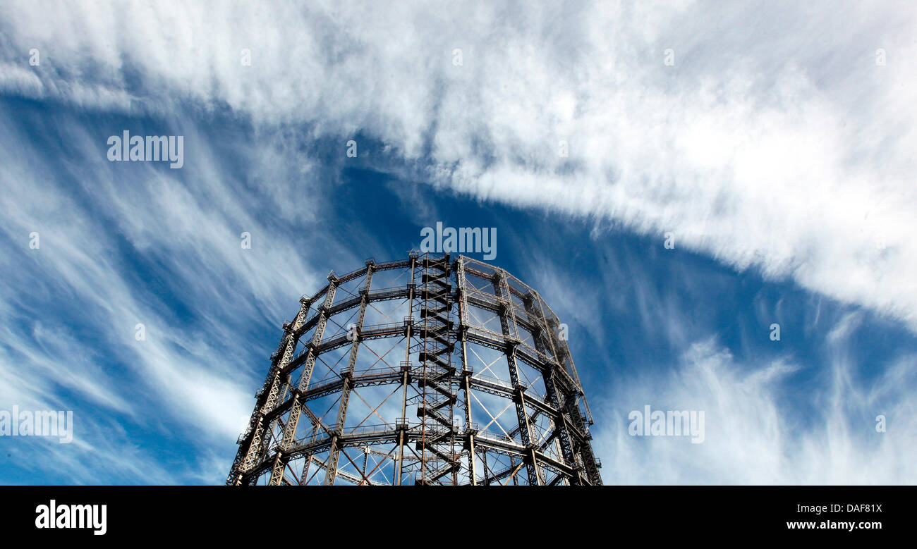 The steel construction of an histric gas meter rises into the sky over ...