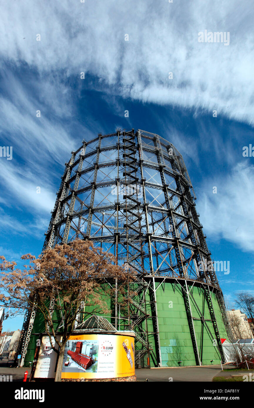 The steel construction of an histric gas meter rises into the sky over ...