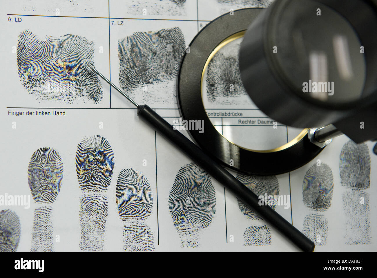 A Palestinian police officer is taught to properly read fingerprints at ...
